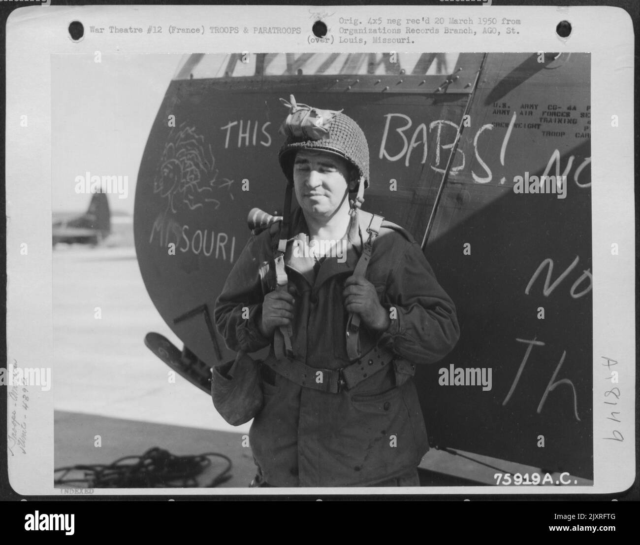 A Member Of The 439Th Troop Carrier Group Poses Beside A Cg-4 Glider ...