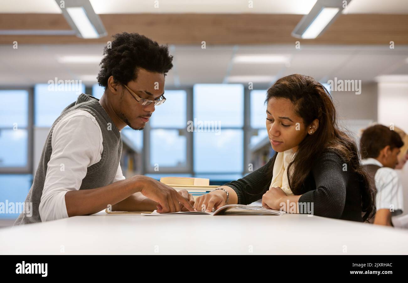 Teenage Students: Working Together. Classmates making use of their ...