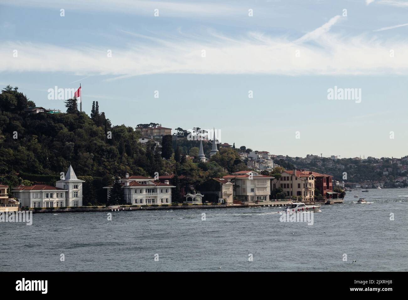 View of boats on Bosphorus and historical and traditional mansions in ...