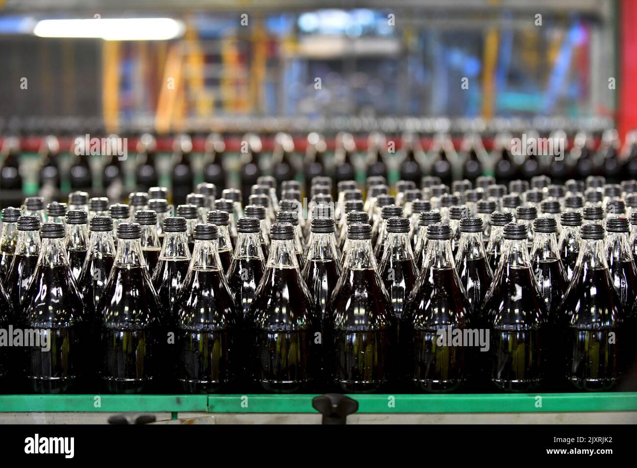 Bottles of Coca-Cola are seen on a production line in Coca-Cola's ...