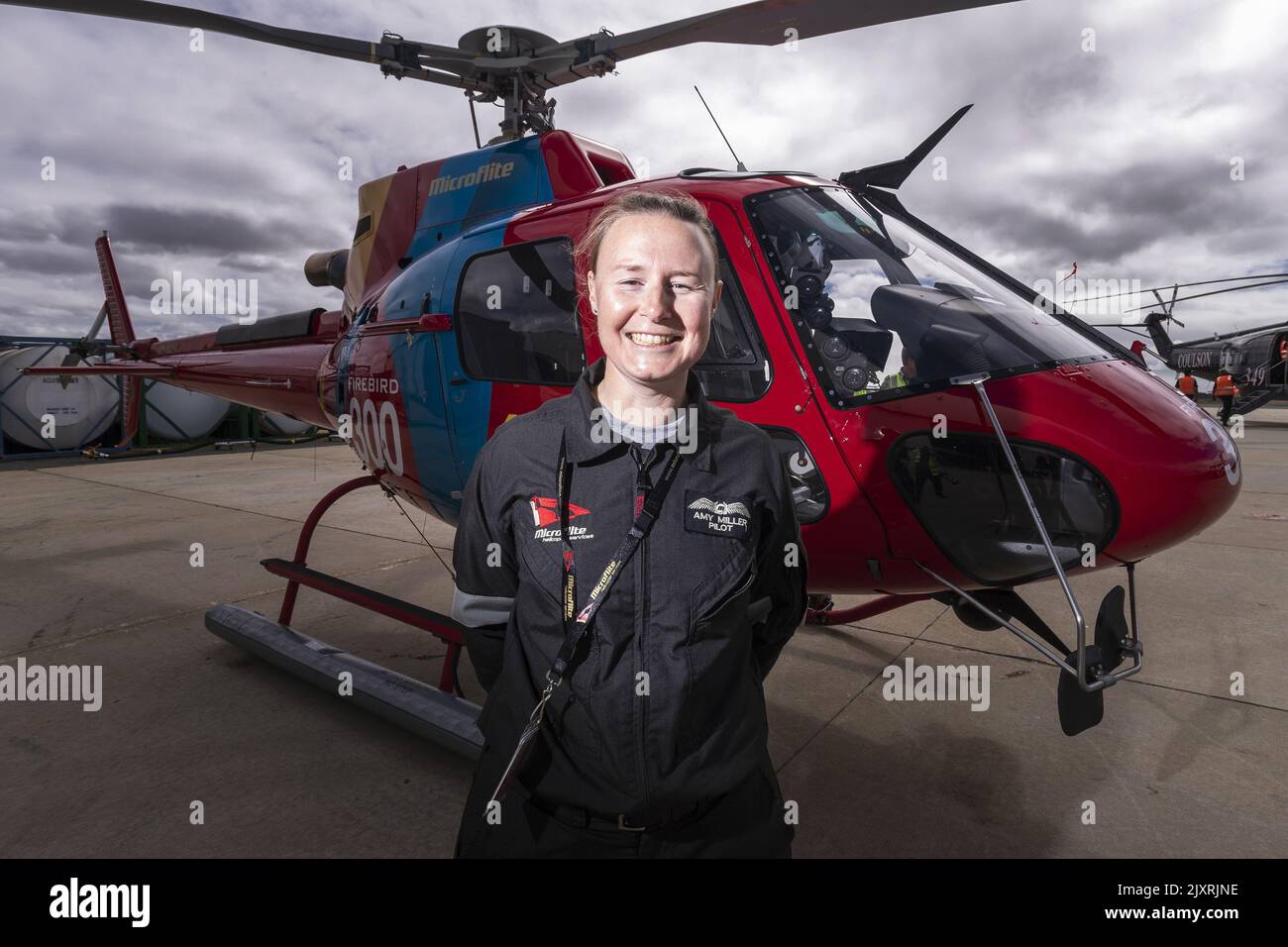 Pilot Amy Miller poses for a photograph in front of a Firebird 300 ...