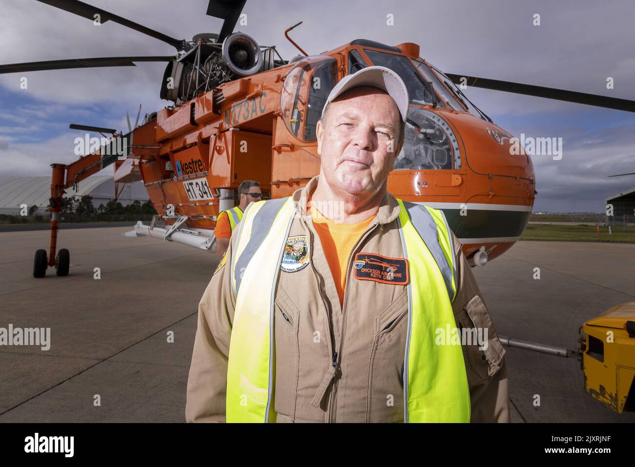 Pilot Keith Gill poses for a photograph in front of an Aircrane during ...