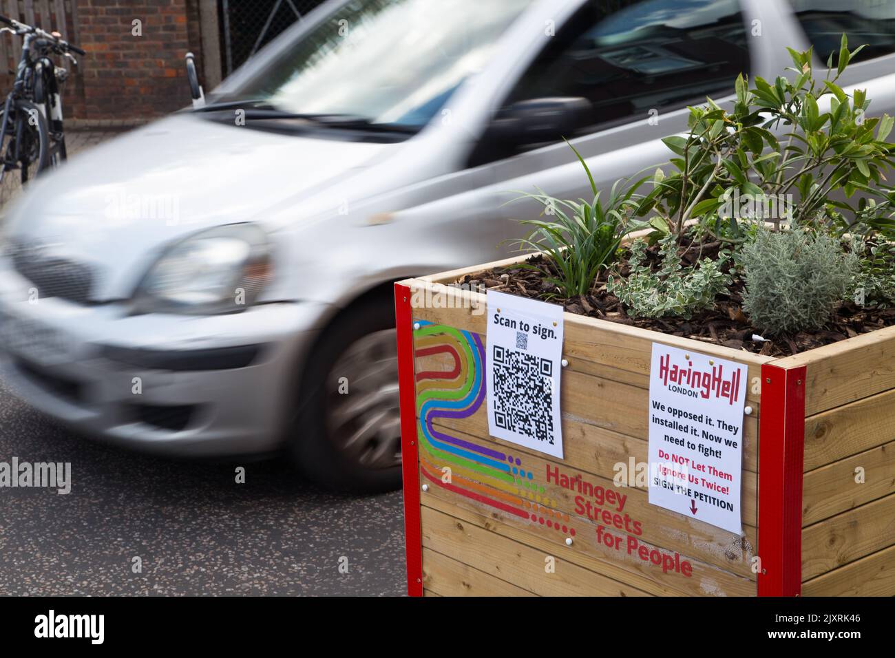 A car passes through barriers signalling a controversial LTN (Low ...