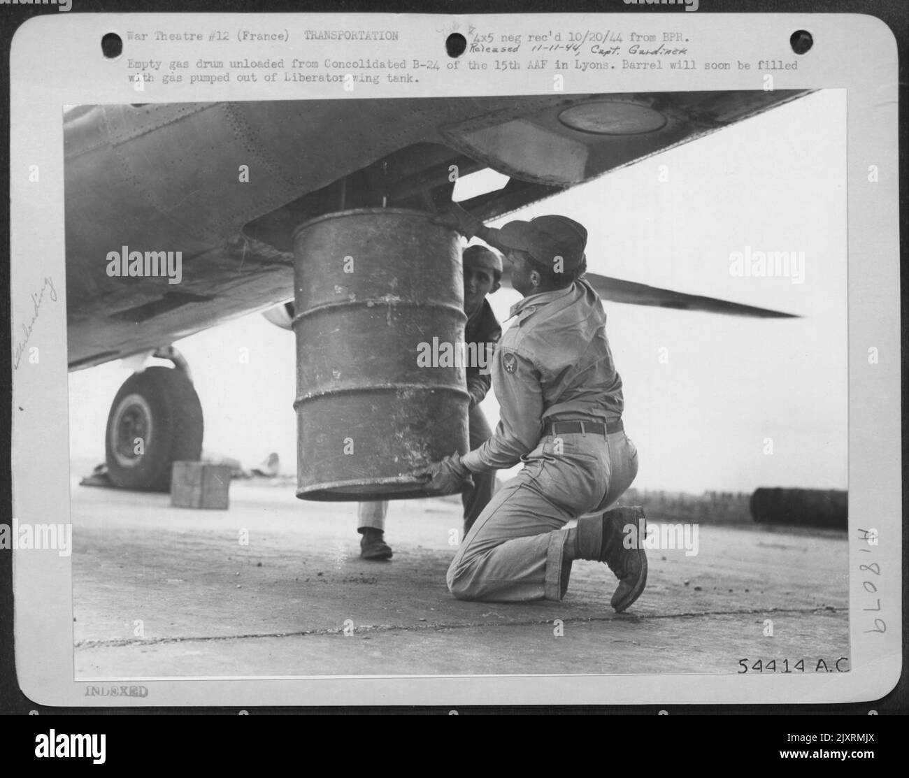 Empty gas drum unloaded from Consolidated B-24 of the 15th AAF in Lyons ...