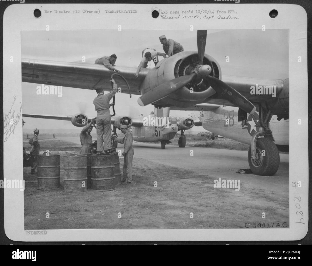 FRANCE-Crew members of 15th AAF pump gas from wing tanks of ...