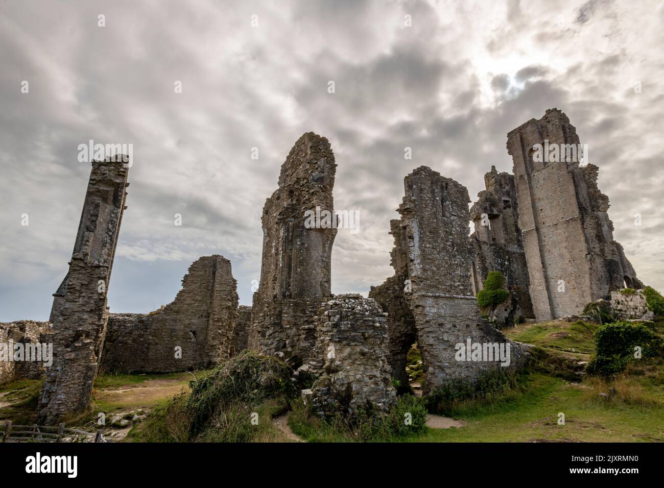 corfe castle in dorset uk under a grey and cloudy menacing and ...