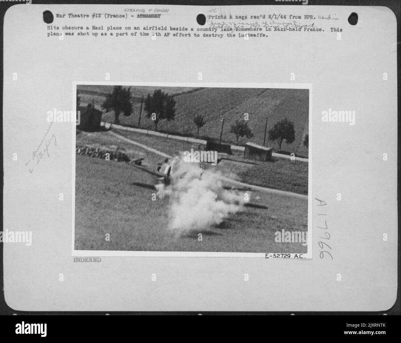 Hits obscure a Nazi plane on an airfield beside a country lane ...