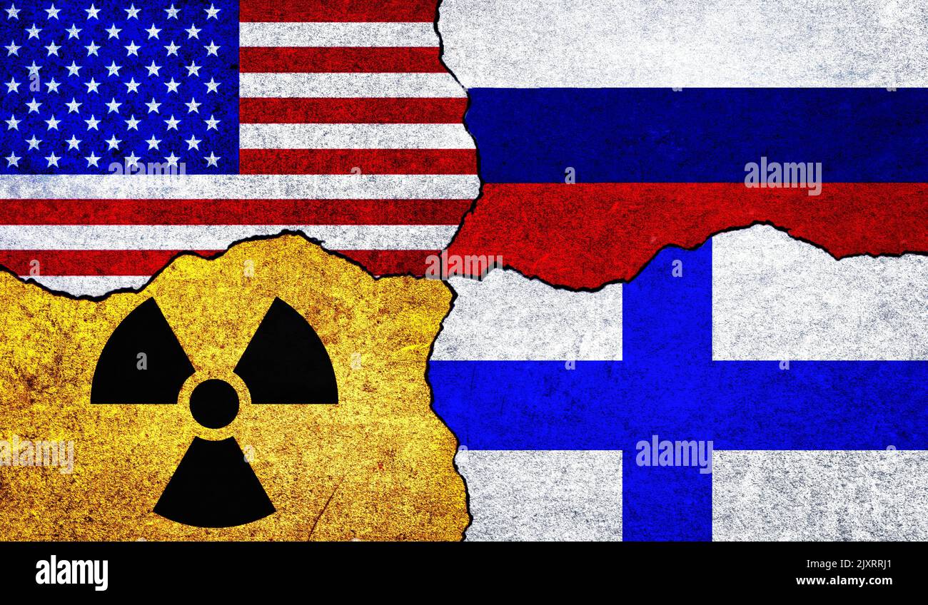 Flags of USA, Russia, Finland and radiation symbol on a wall. United ...