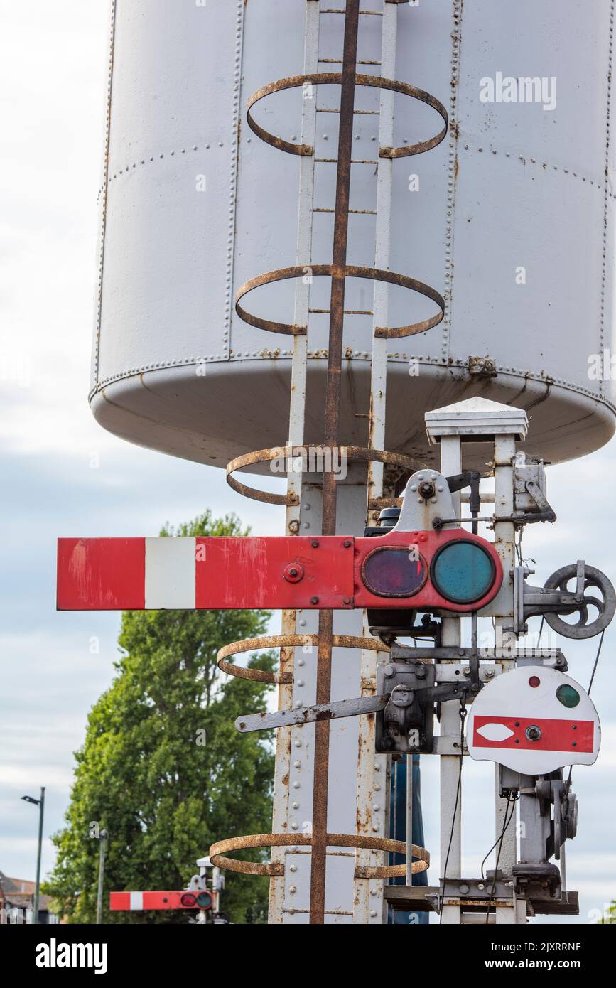 old steam railway water tank and semaphore signal arm at the ...