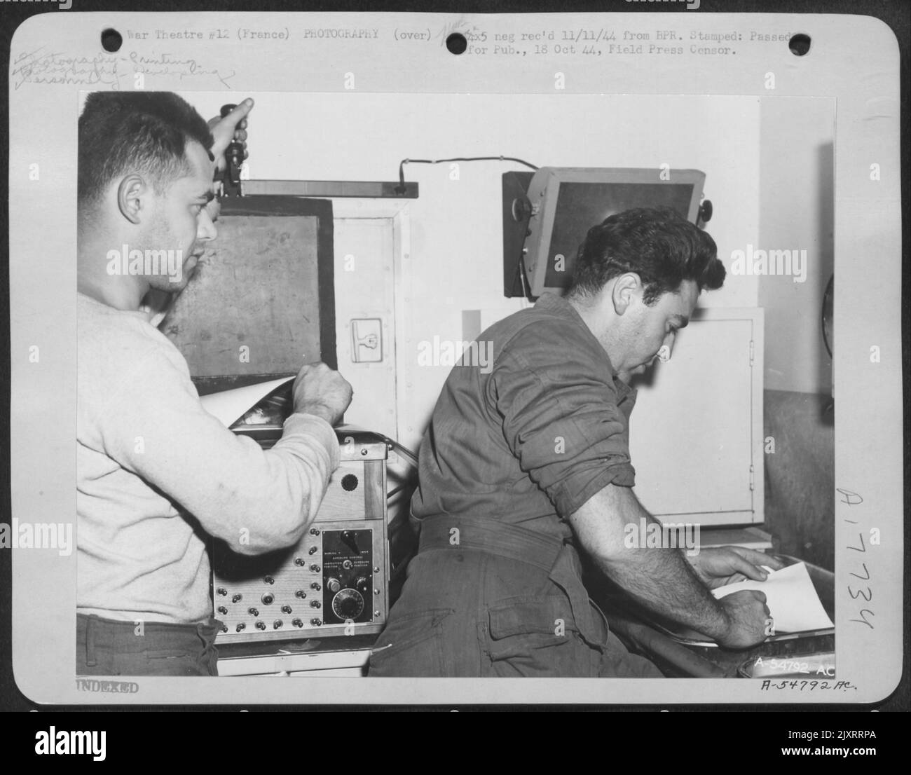 Two 9th AF enlisted men, Harris Levy (left) of N.Y.C. prints and Martin ...
