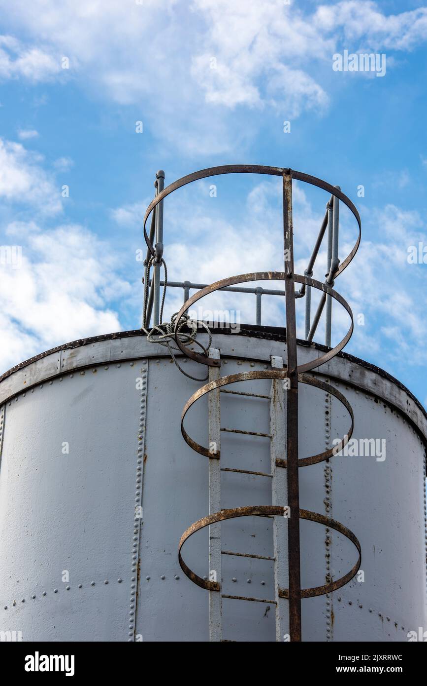 hoop ladder on the side of a large silo or tank, industrial tank with ...