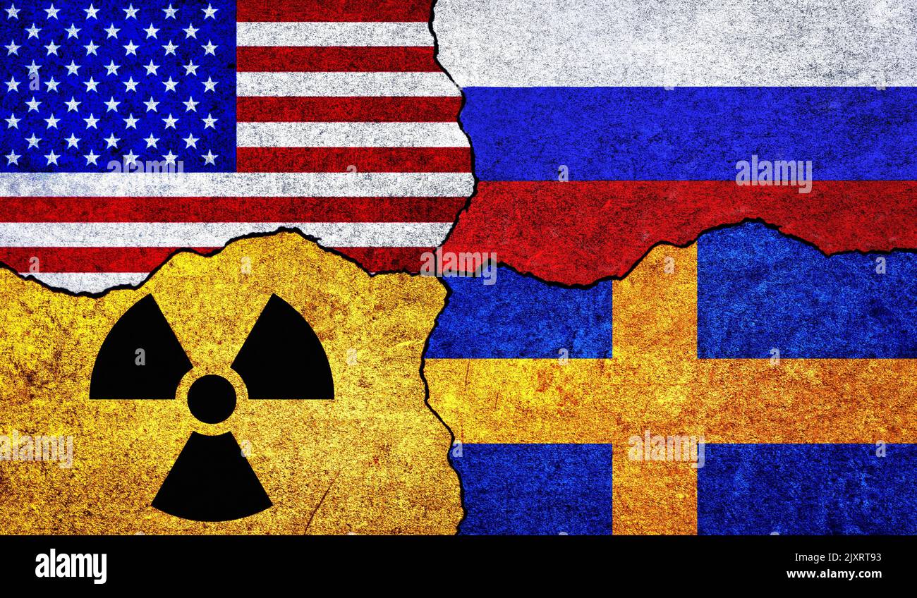 Flags of USA, Russia, EU and radiation symbol on a wall. United States ...