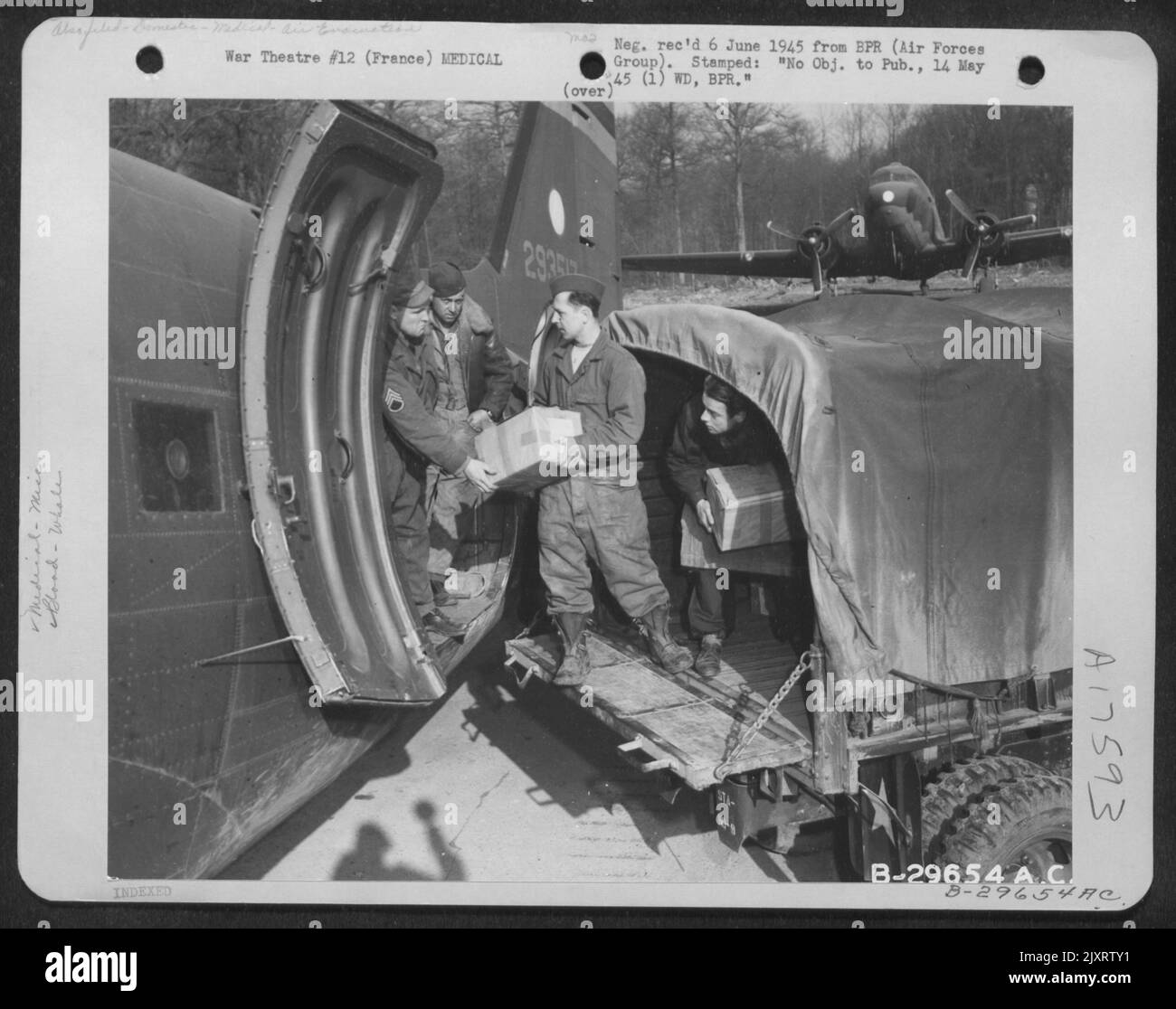 Whole blood being loaded aboard a Douglas C-47 going to the front ...