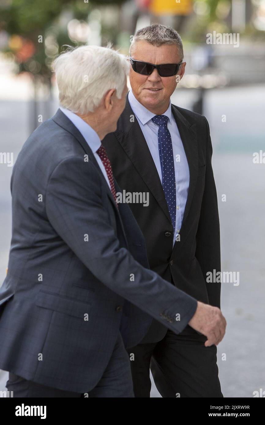 Ex-CFMEU boss Dave Hanna (right) arrives with his lawyers at the ...