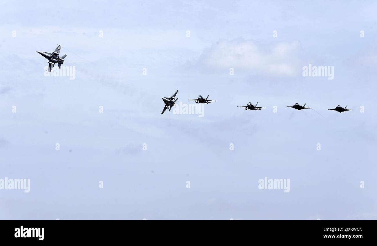 Four FA 18 Hornets peel off after escorting the two new F-35A Joint ...