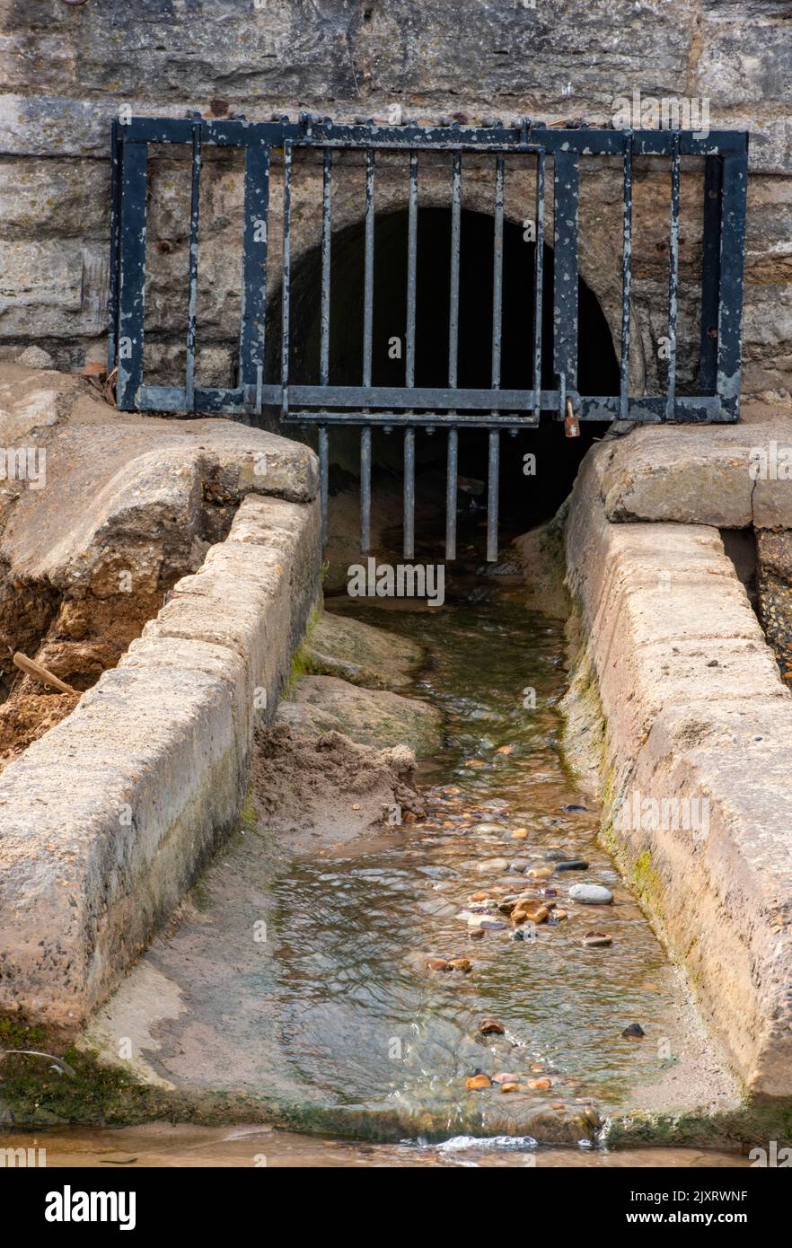 sewage outlet on the beach, treated sewage pipeline emptying onto a ...