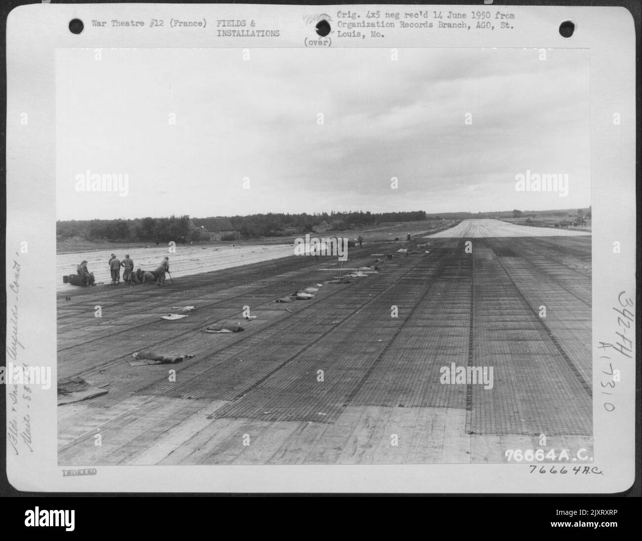 Wire Mesh Is Laid On The Surface Of A Runway By Men Of The 834Th ...