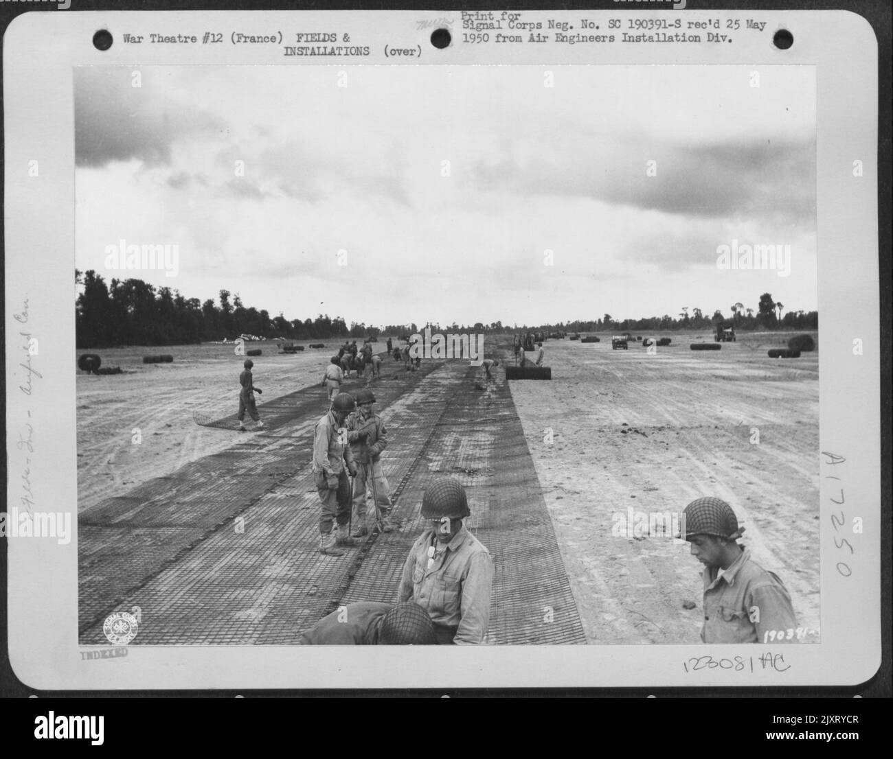 American Air Force Men Laying Down One Of The Landing Strips Which Are ...