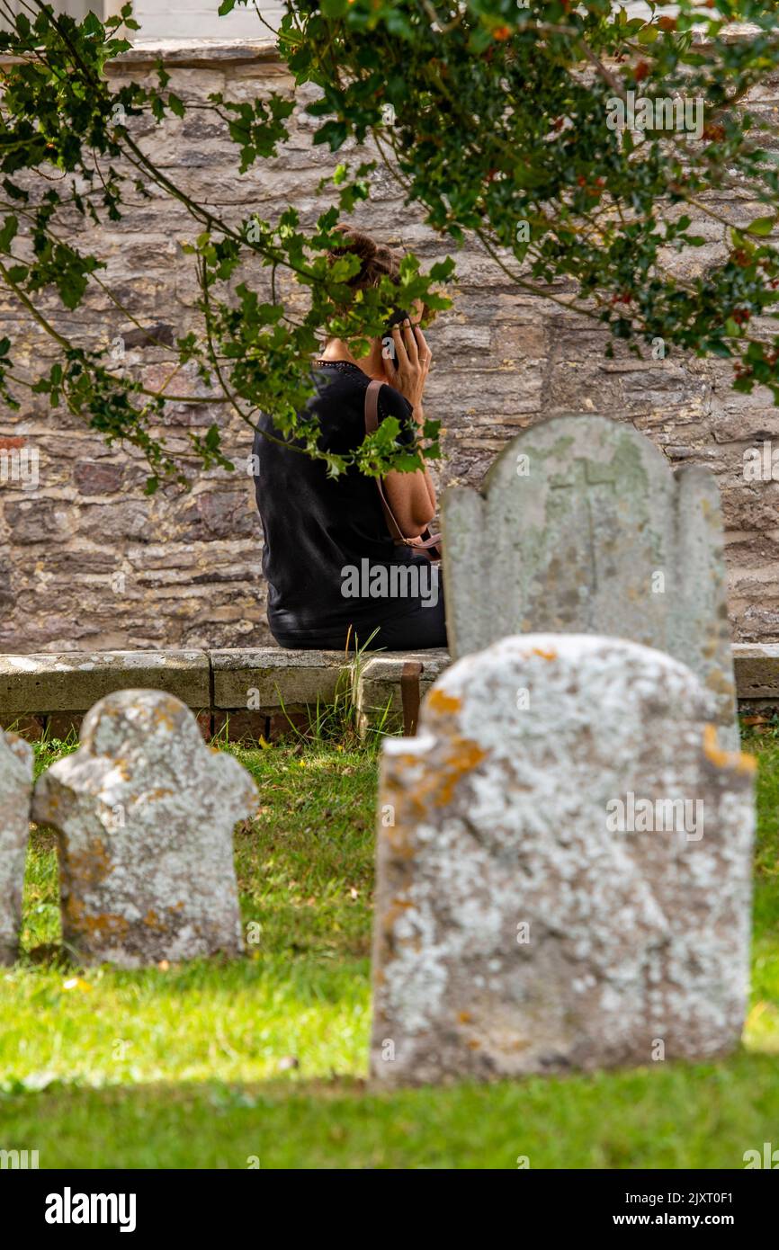 Woman shaded under tree hi-res stock photography and images - Alamy