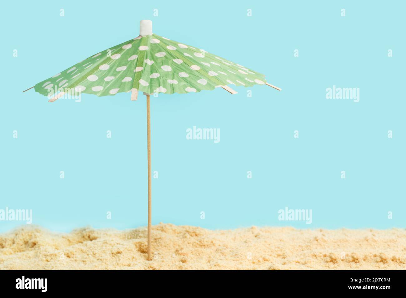 Green umbrella with white polka dots hi-res stock photography and ...