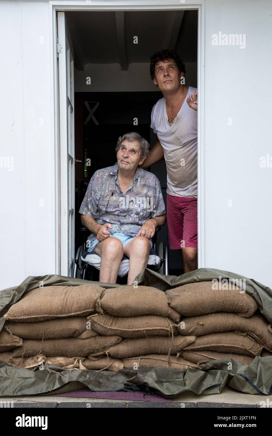 Parramatta Park resident John Irving, 81, had his front door sandbagged ... Parramatta Park resident John Irving, 81, had his front door sandbagged ...