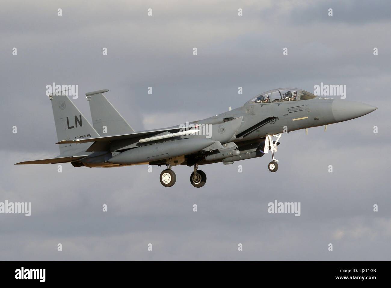 48th Fighter Wing F-15E returning to RAF Lakenheath against a moody sky ...
