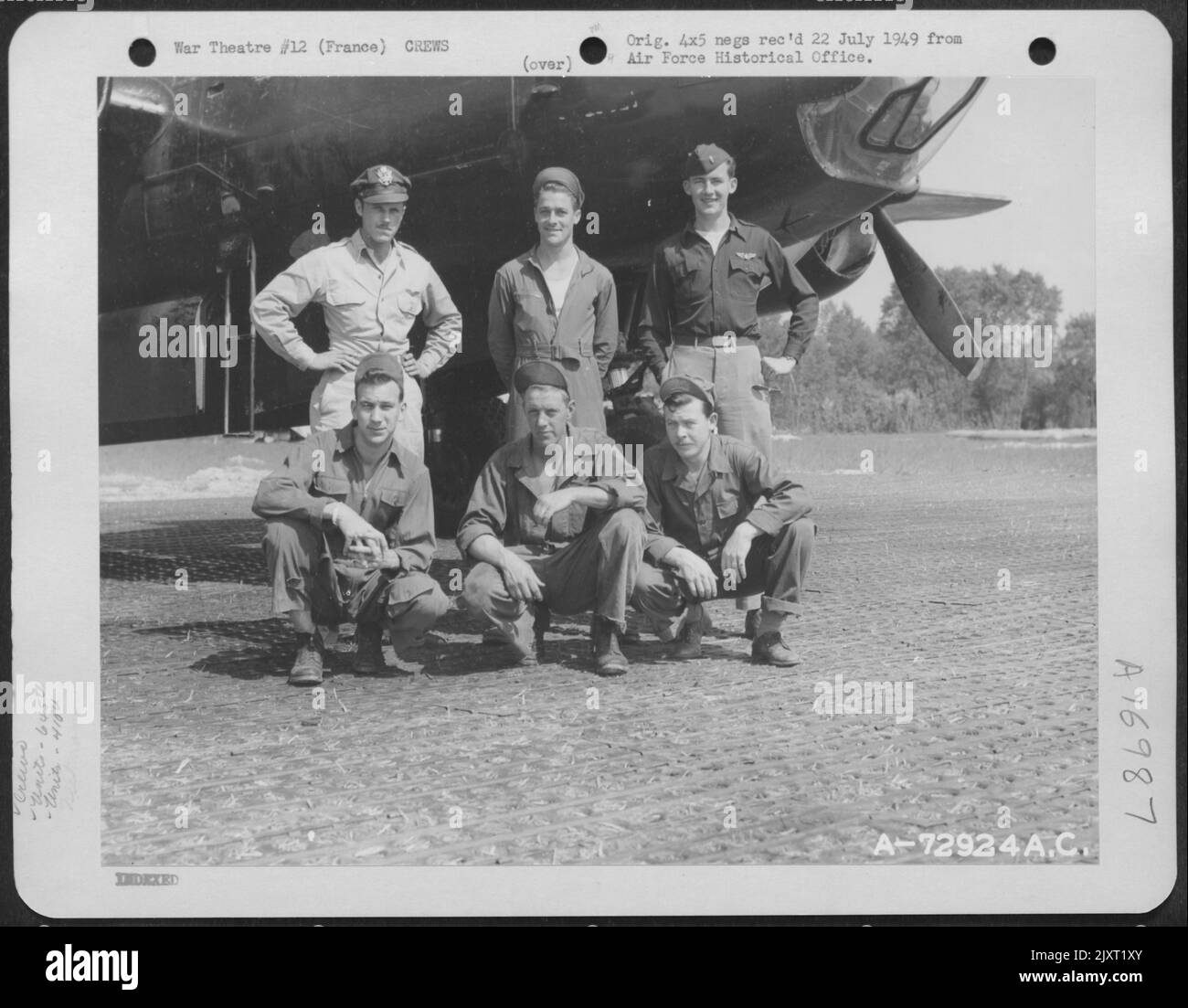 Crew Members Of The 645Th Bomb Squadron, 410Th Bomb Group Pose Beside ...