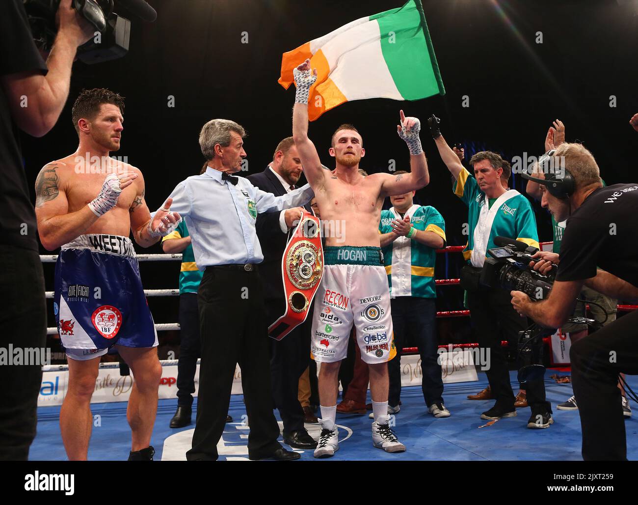 Boxer Dennis Hogan (right) celebrates his win against Jamie Weetch ...
