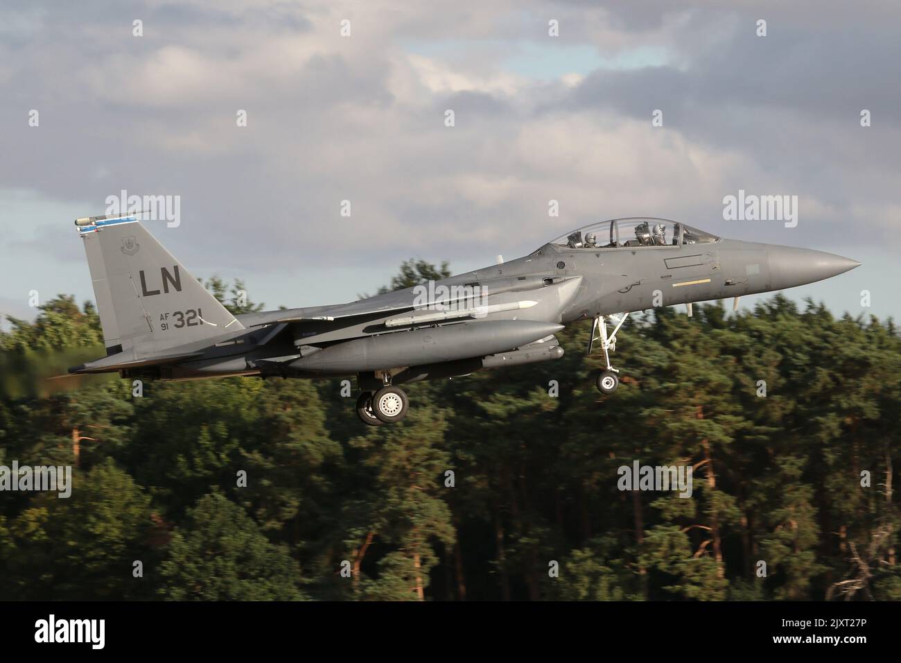 48th Fighter Wing F-15E returning to RAF Lakenheath against a moody sky ...