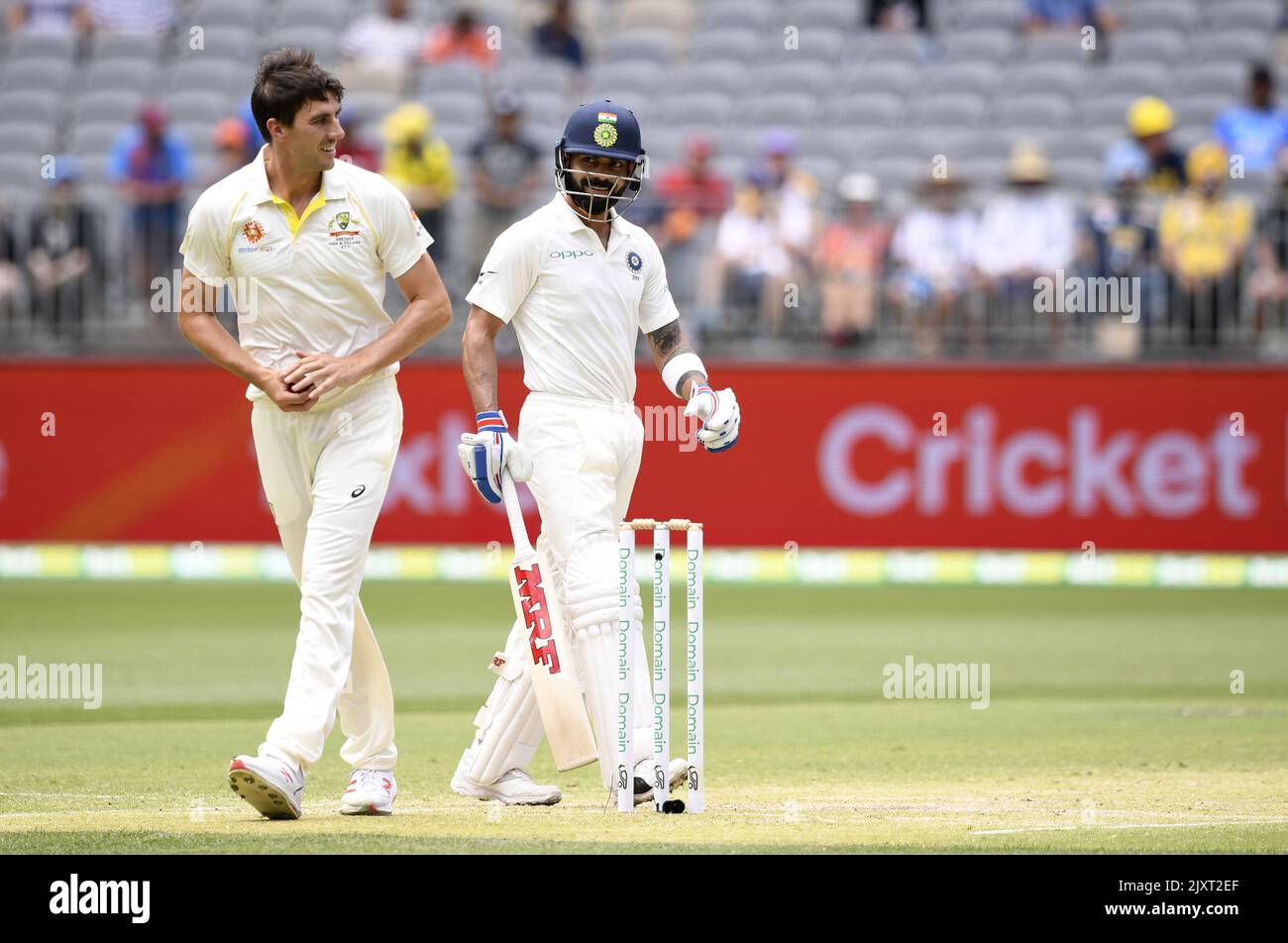Australian bowler Pat Cummins (left) and Indian batsman Virat Kohli ...