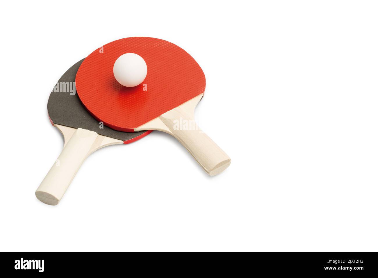 Red and black ping pong paddles with a white ball on a white background ...