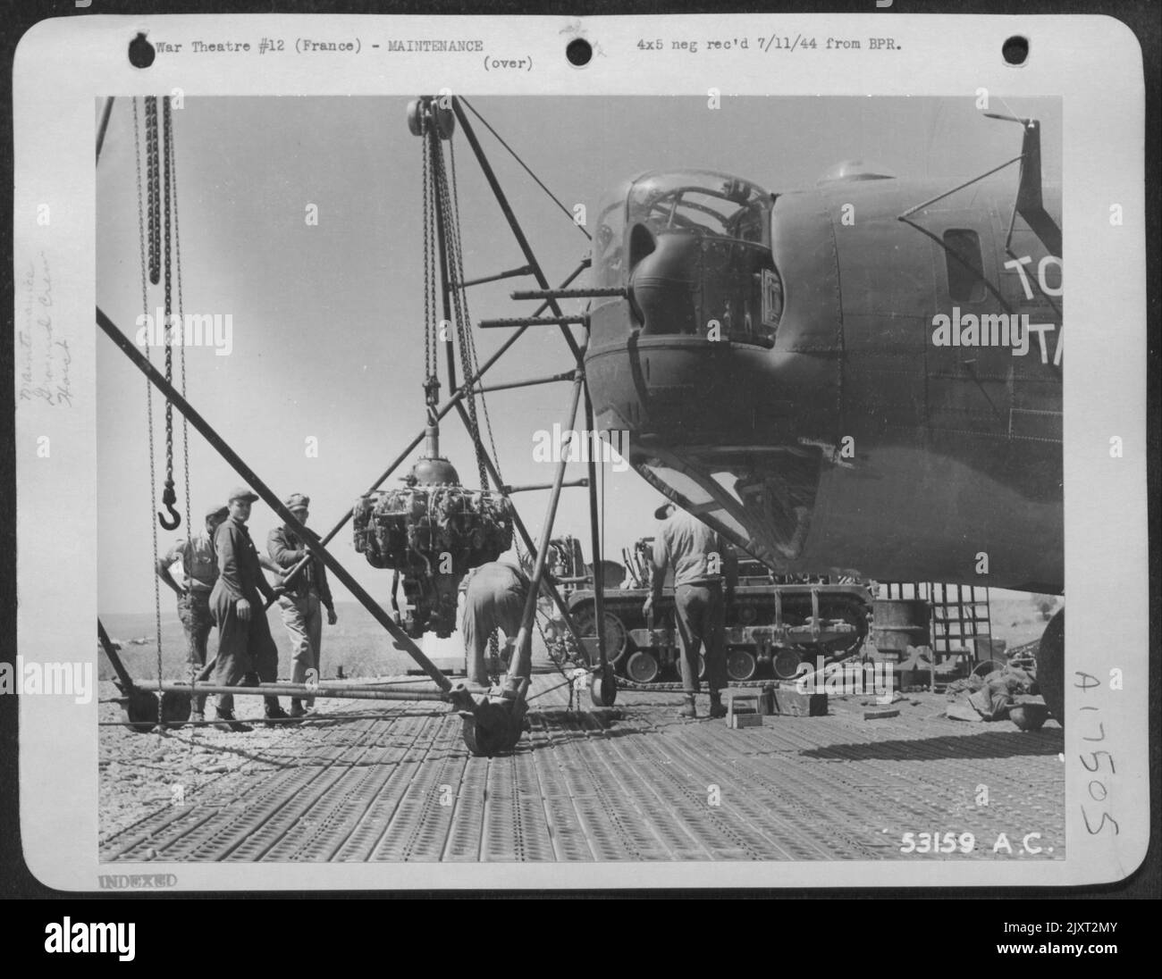 Maintenance on the line effects quick engine change on Liberator bomber ...