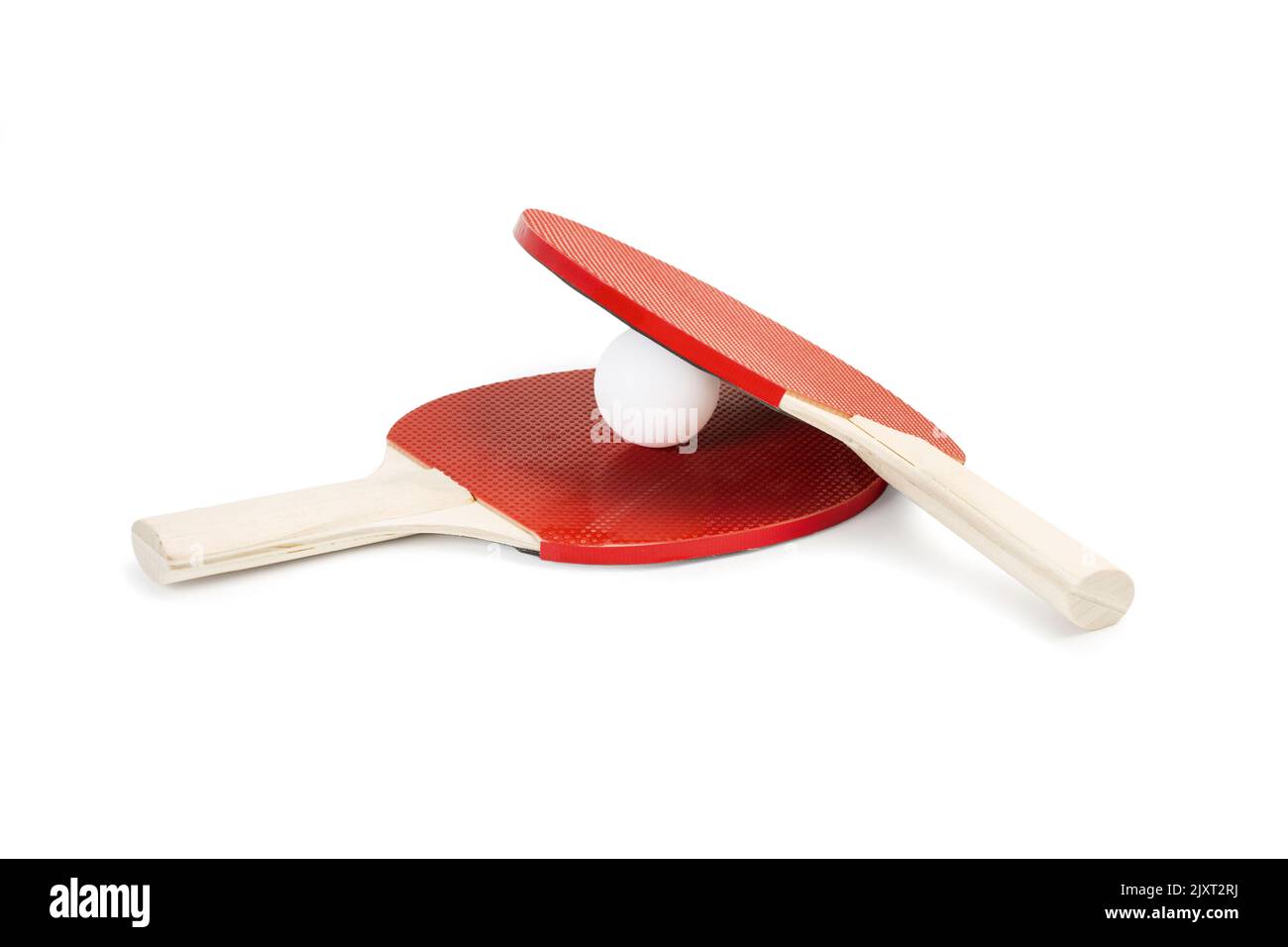 Two red ping pong paddles and a white ball on a white background Stock ...