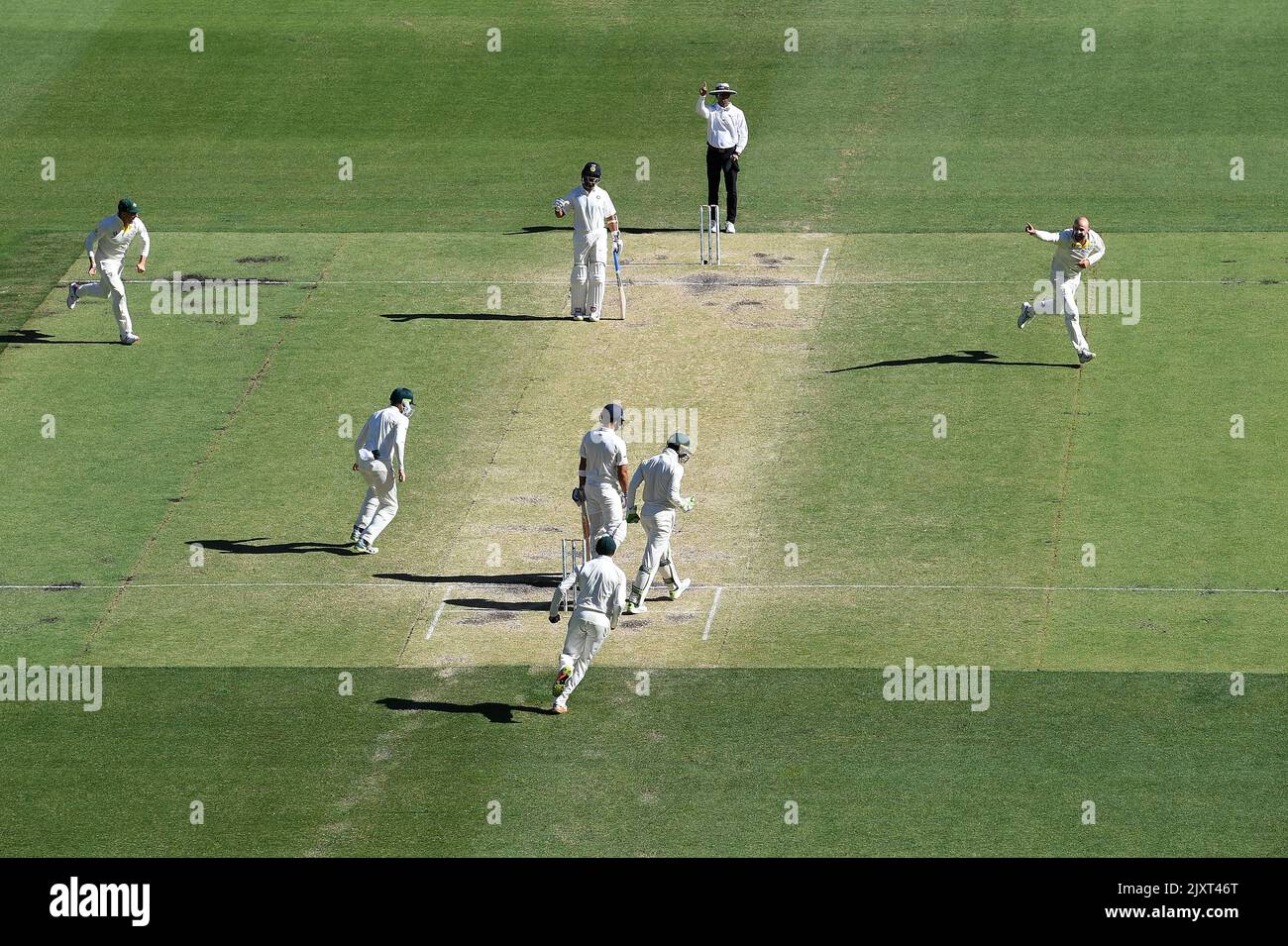 Australian bowler Nathan Lyon (right) reacts after dismissing Indian ...