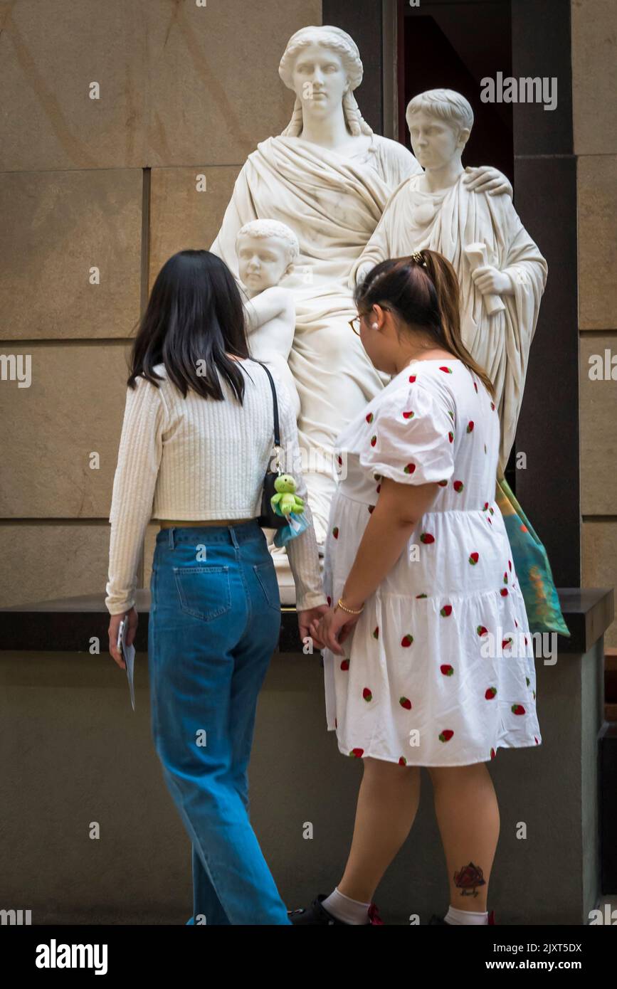 Two girls passing by a sculpture, Musée d'Orsay, Paris, France Stock ...