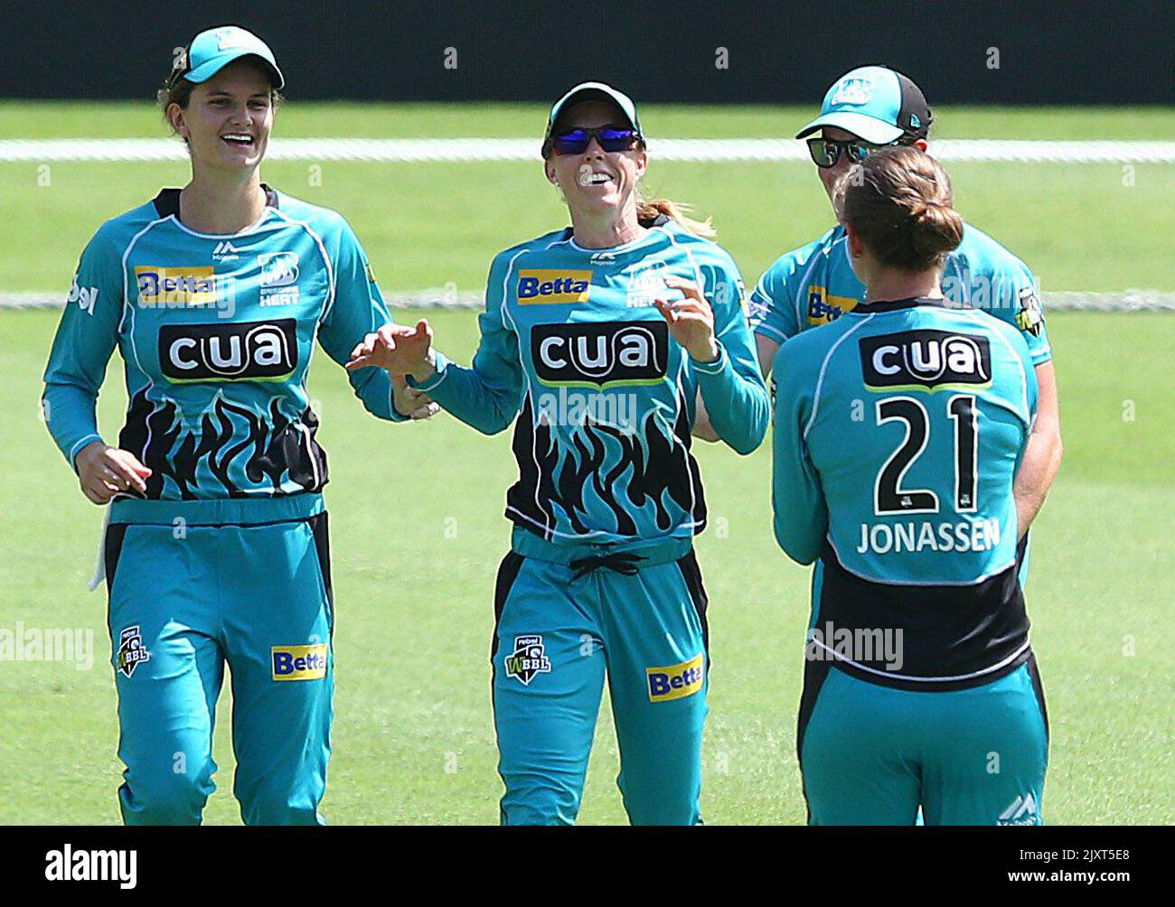 Kirby Short of the Heat (centre) celebrates taking a catch during the ...