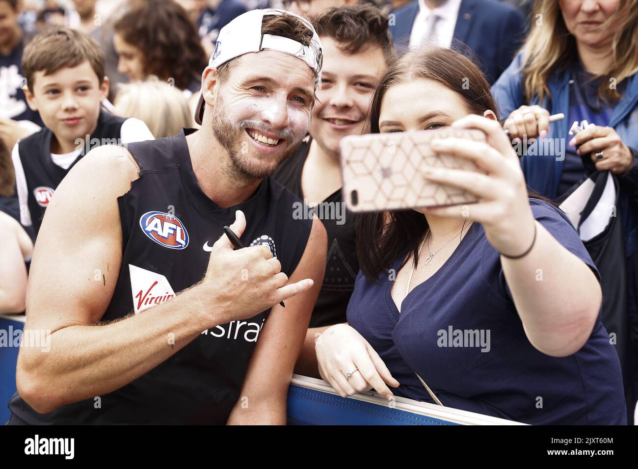 Dale Thomas poses for a selfie with fans during a Carlton Blues ...