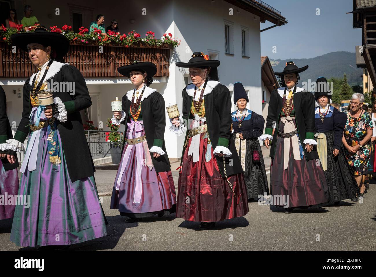 Women wearing traditional local period costume of wide brimmed hats and ...