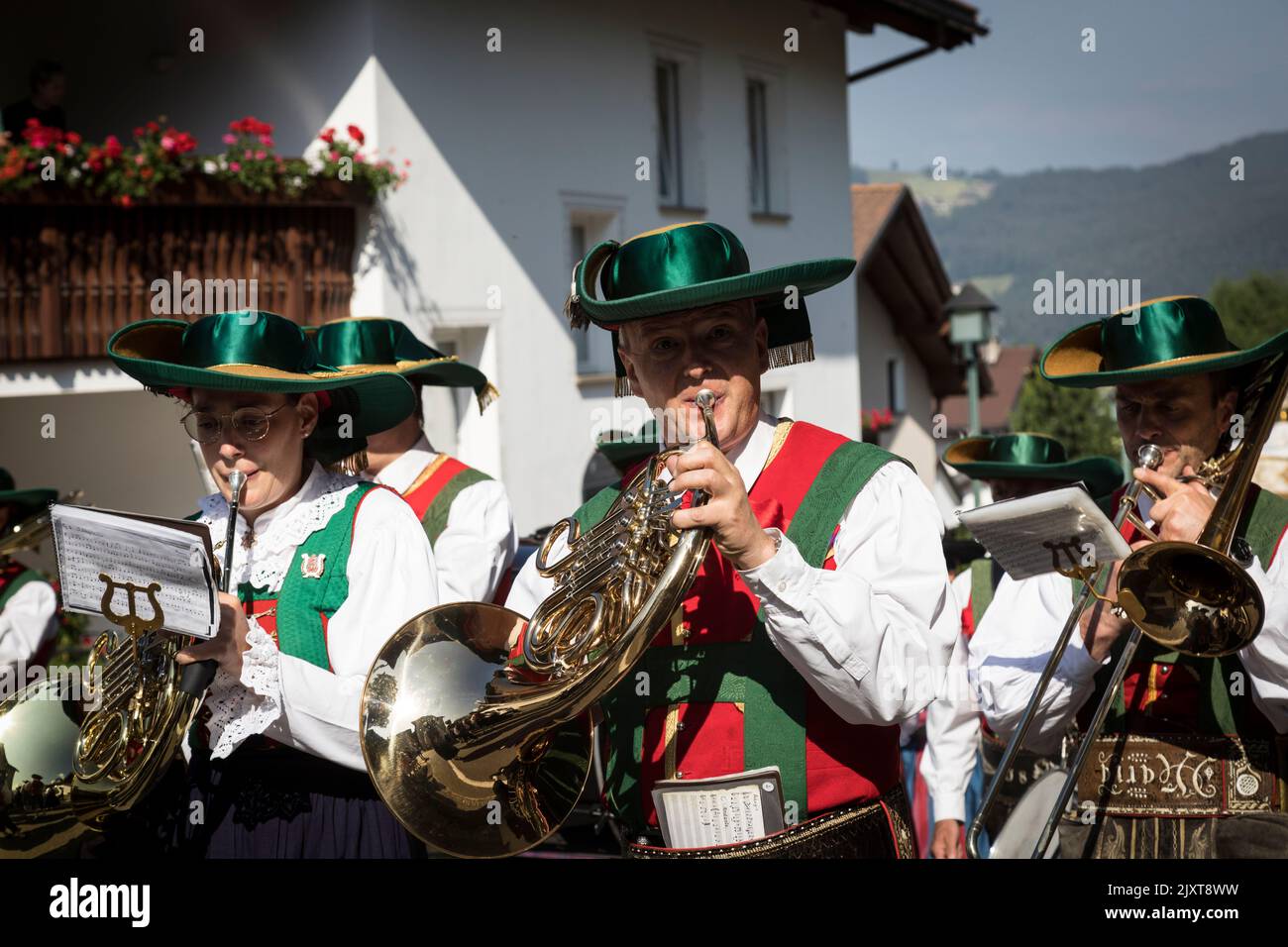 Men and women musicians wearing traditional local period costume take ...