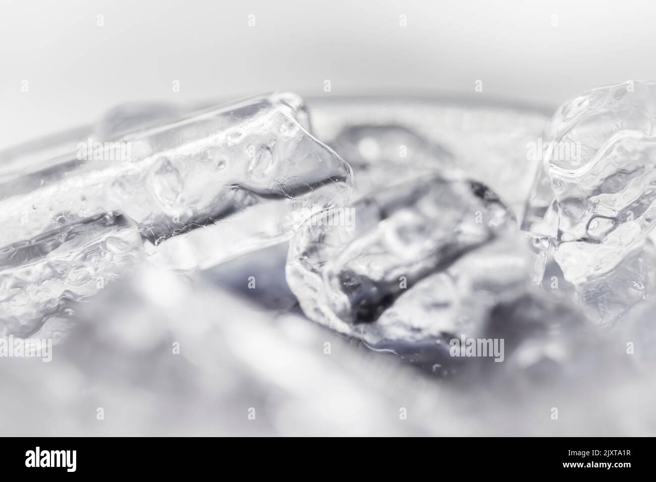 The heap of shiny ice cubes on a white background Stock Photo - Alamy