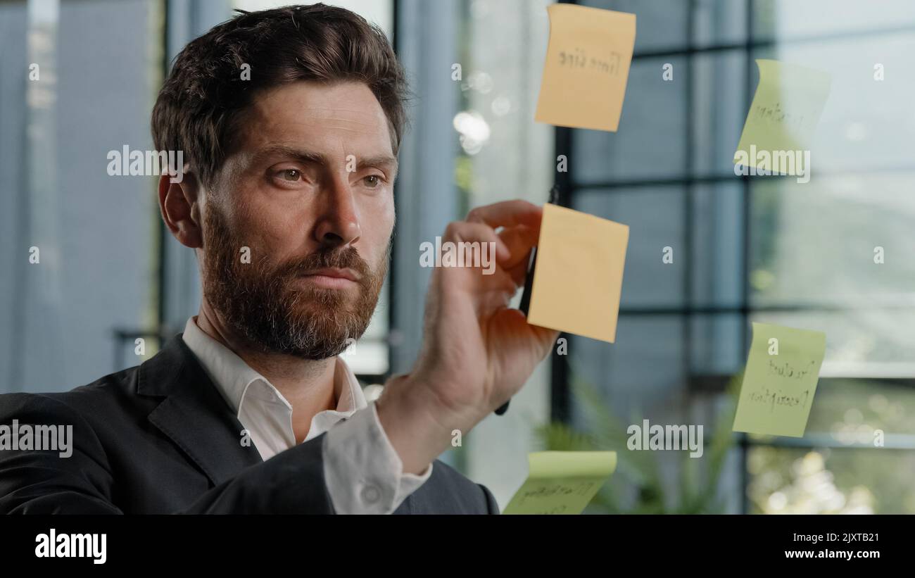 Close up busy focused smart male manager worker CEO boss planning work ...