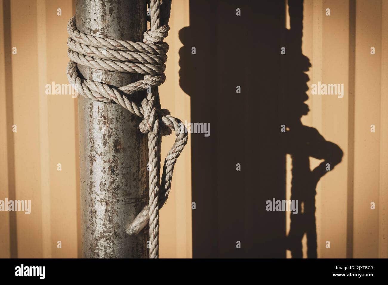 Old rope tied wooden pole hi-res stock photography and images - Alamy