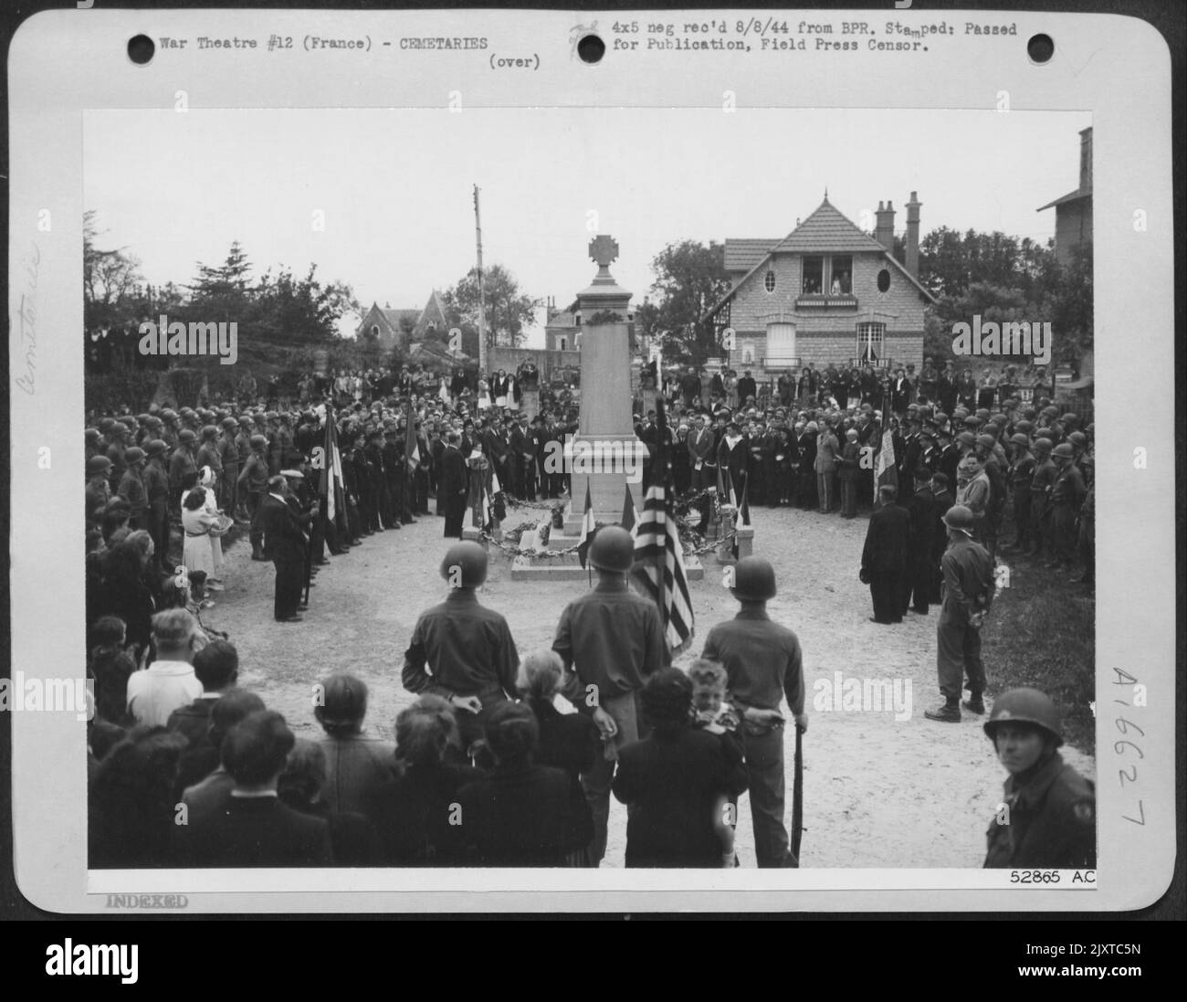 Flanked by units of a 9th Air force, citizens of a village behind the ...