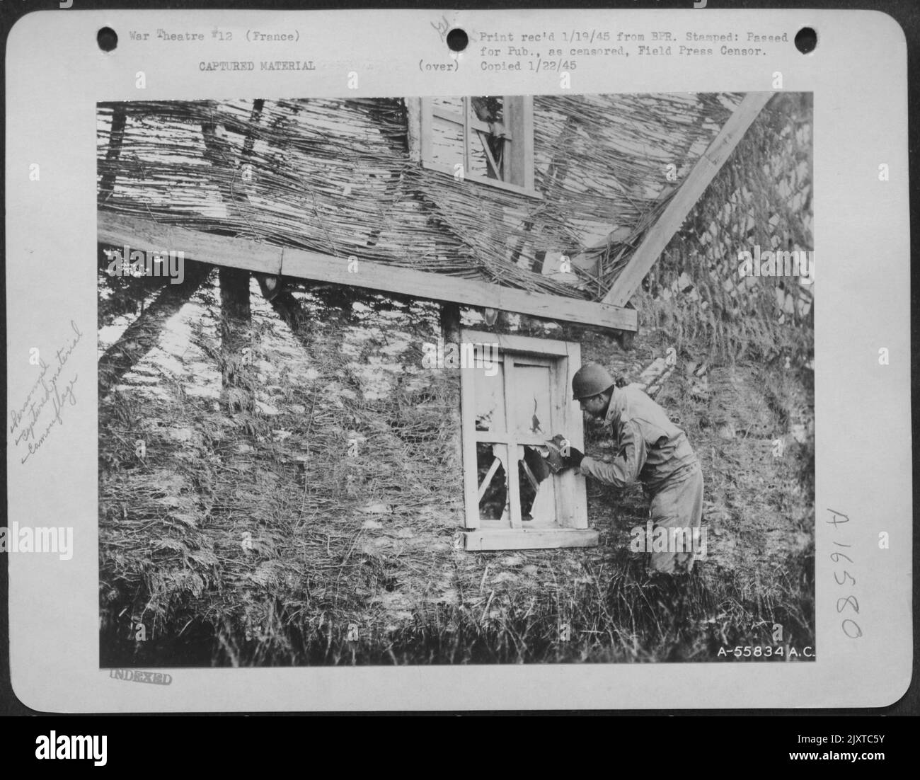 Cpl. Marion R. Sams of High Point, N.C., eavesdrops through the paper ...