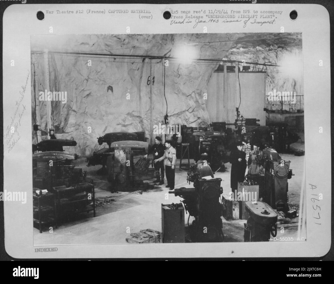 UNDERGROUND AIRCRAFT PLANT-A cluster of big lathes, mostly of German ...