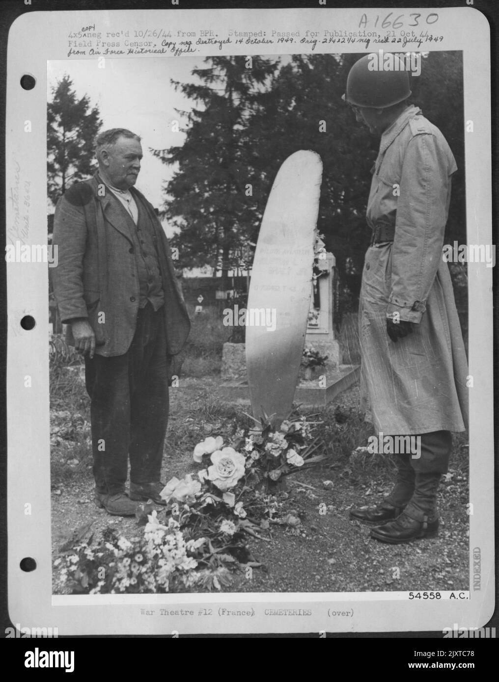 An American officer visits the grave of Lt. Houston L. Braly, Jr., of ...