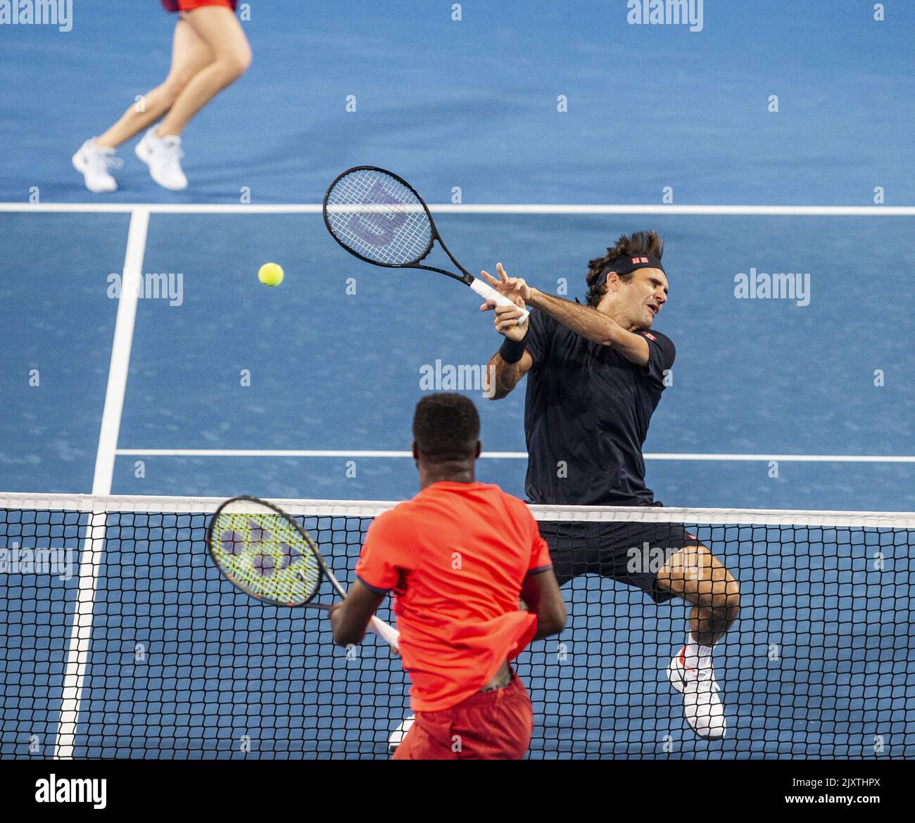Roger Federer of Switzerland is hit on the ear by a ball from Frances ...