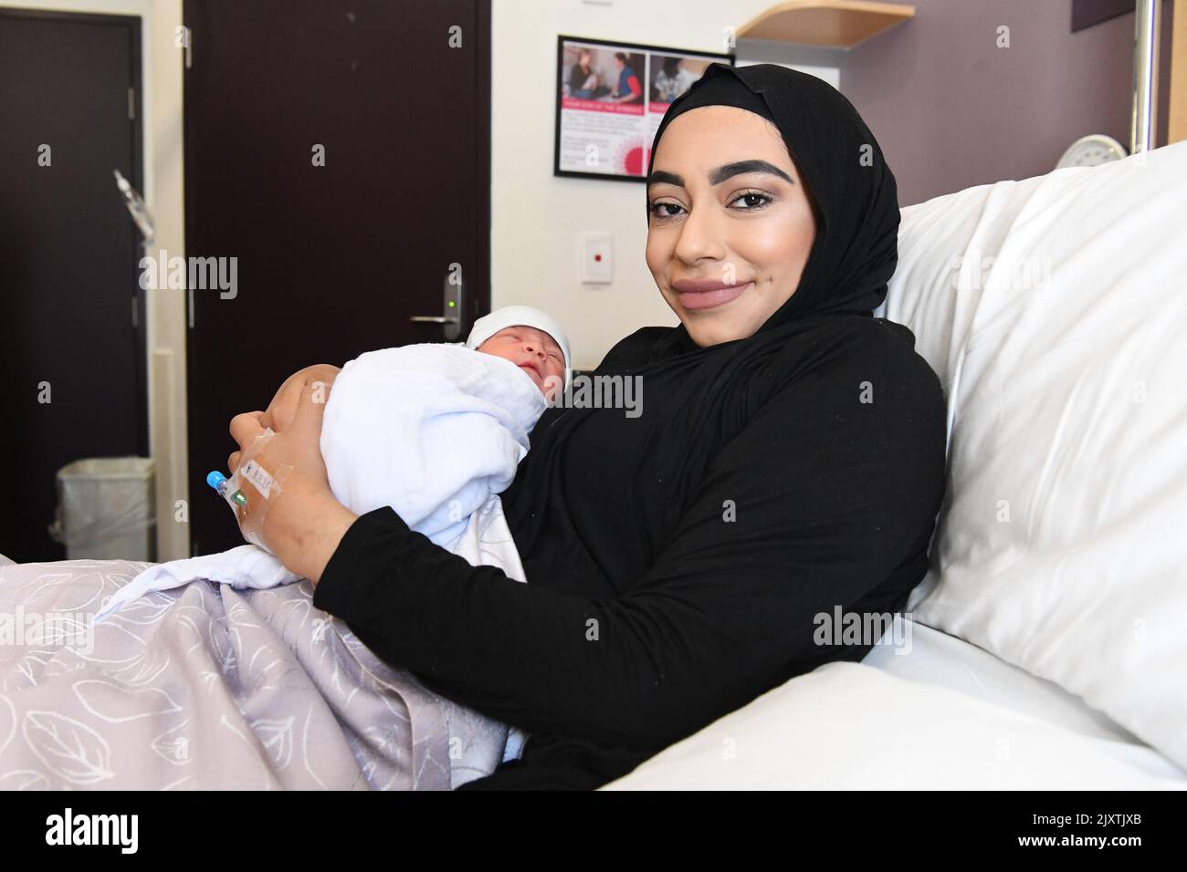 Priscilla Perez poses for a photograph with her newborn son Noah Perez ...