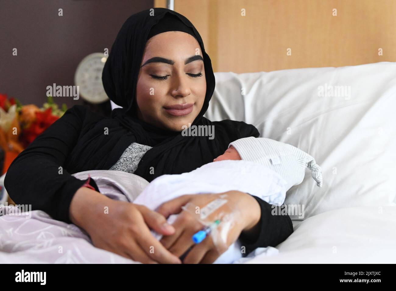Priscilla Perez poses for a photograph with her newborn son Noah Perez ...