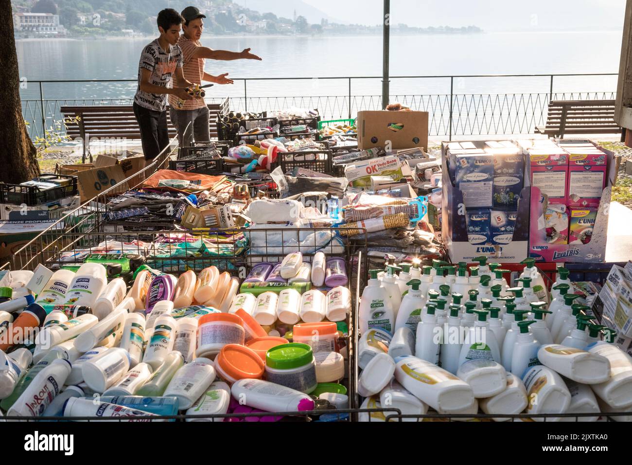 Market traders layout their stall of household goods alongside Lake ...